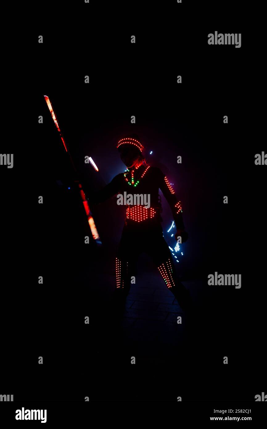 Light emitting dancer performing in the dark with led suit and gloves ...