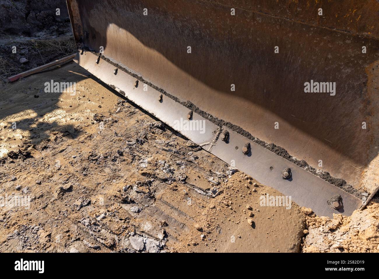road construction work during the excavation of a pit for laying ...