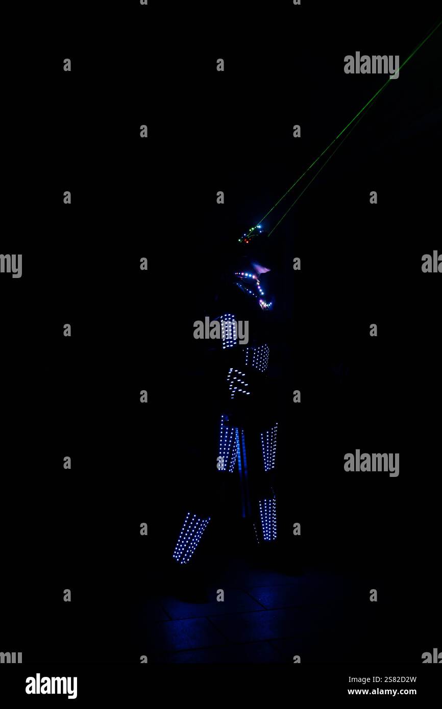 Light emitting dancer performing in the dark with led suit and gloves ...