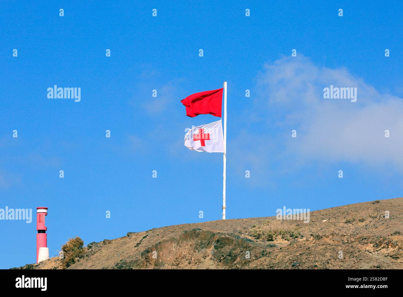 Life guard (cruz roja) flags flying at Piedra Playa beach, El Cotillo ...