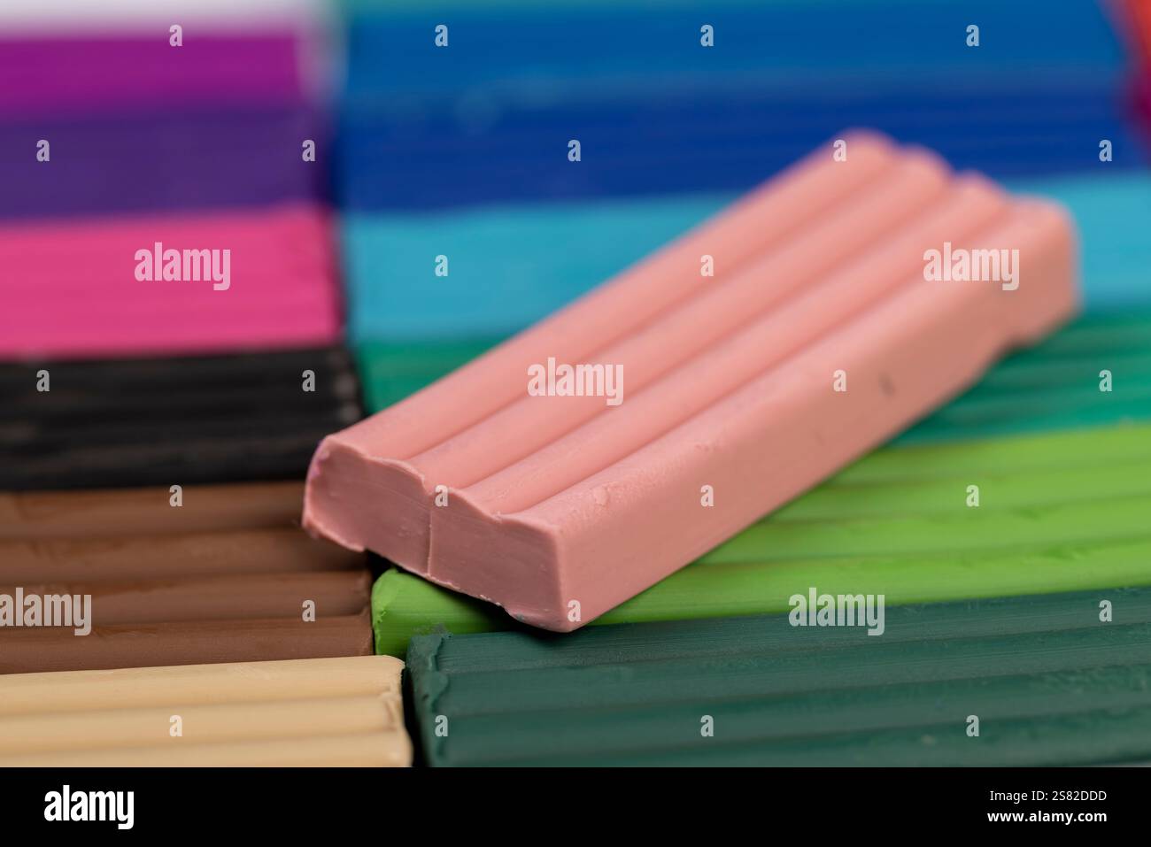 plasticine of different colors for modeling closeup, a simple colored ...