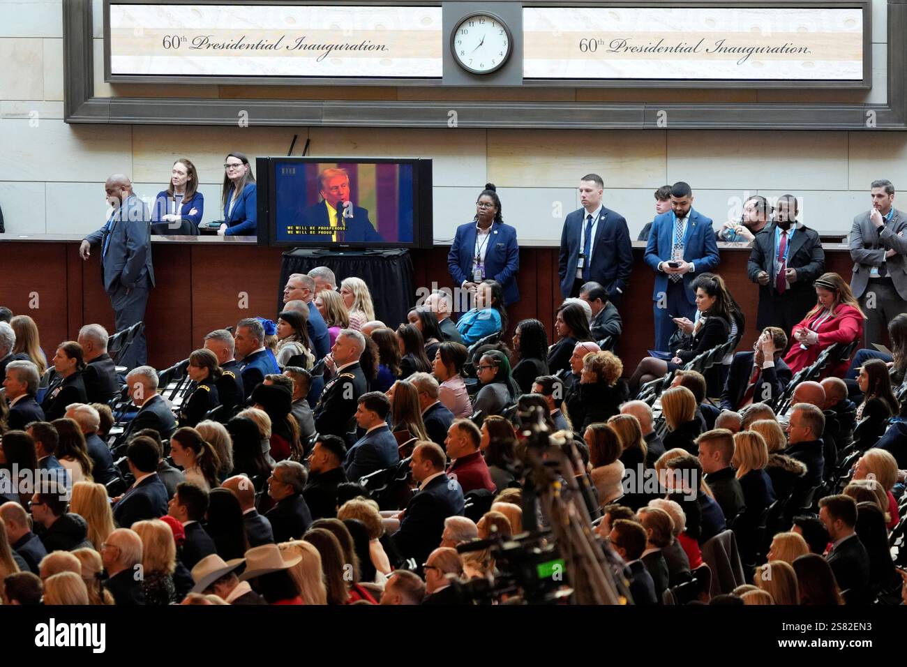 Guests watch from Emancipation Hall as President Donald Trump speaks at ...