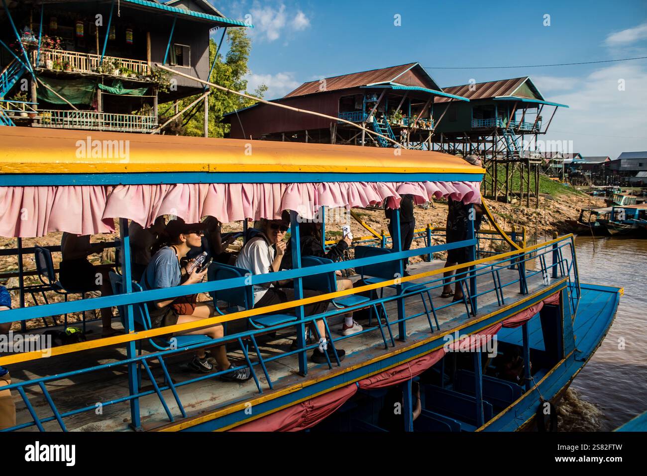 Kampong Phluk, Cambodia, January 15, 2025. Boats sail into the ...