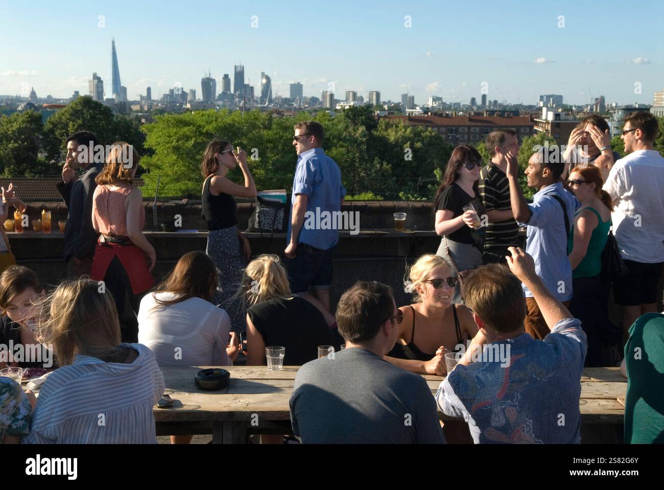 Rooftop bar Peckham, London. City skyline view 2010s UK. Franks Campari ...