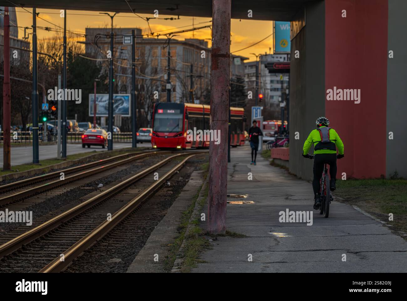 Red trams in Vinohrady part of capital of Slovakia in winter evening in ...