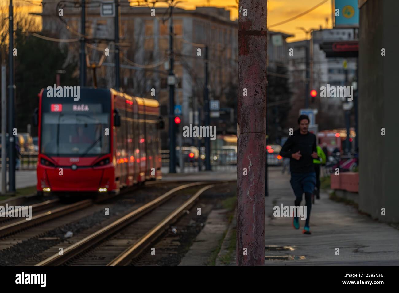 Red trams in Vinohrady part of capital of Slovakia in winter evening in ...