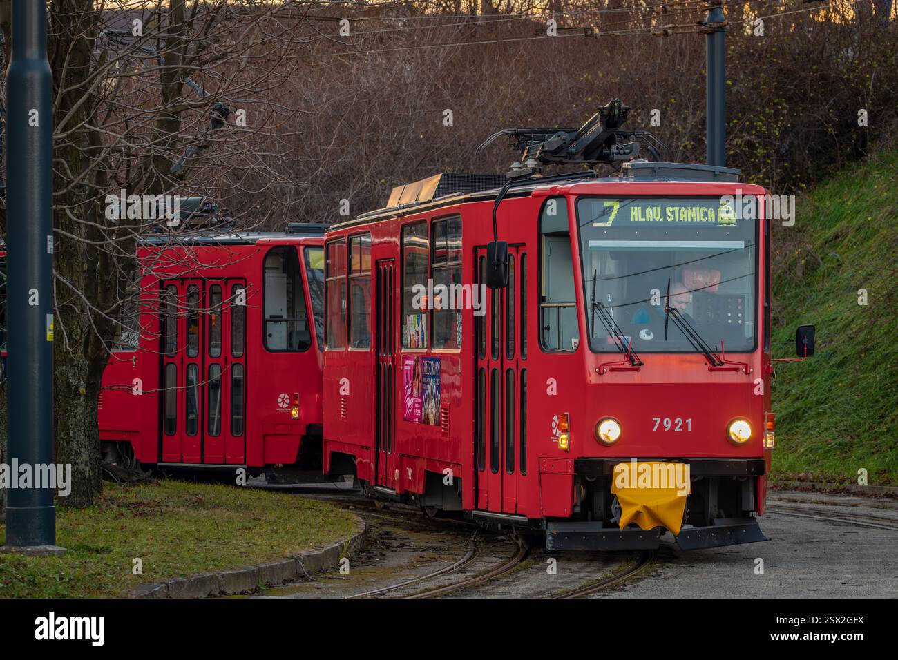 Red trams in Vinohrady part of capital of Slovakia in winter evening in ...