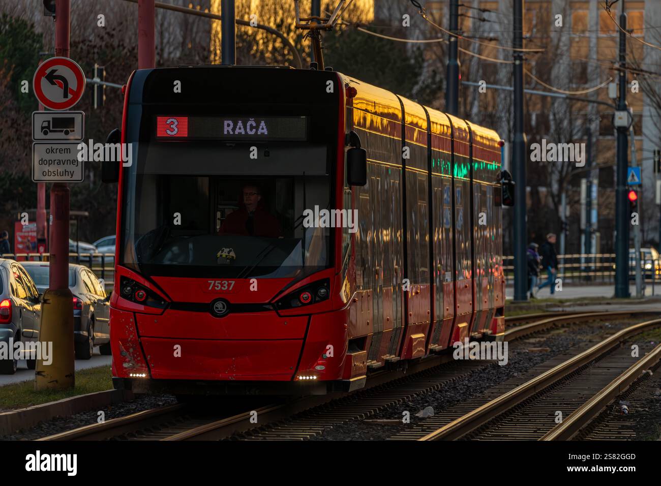 Red trams in Vinohrady part of capital of Slovakia in winter evening in ...