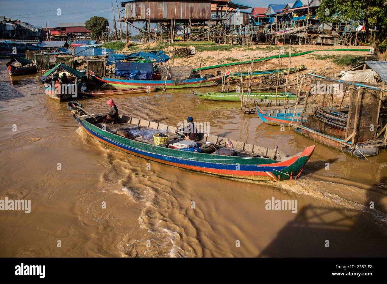 Kampong Phluk, Cambodia, January 15, 2025. Boats sail into the ...