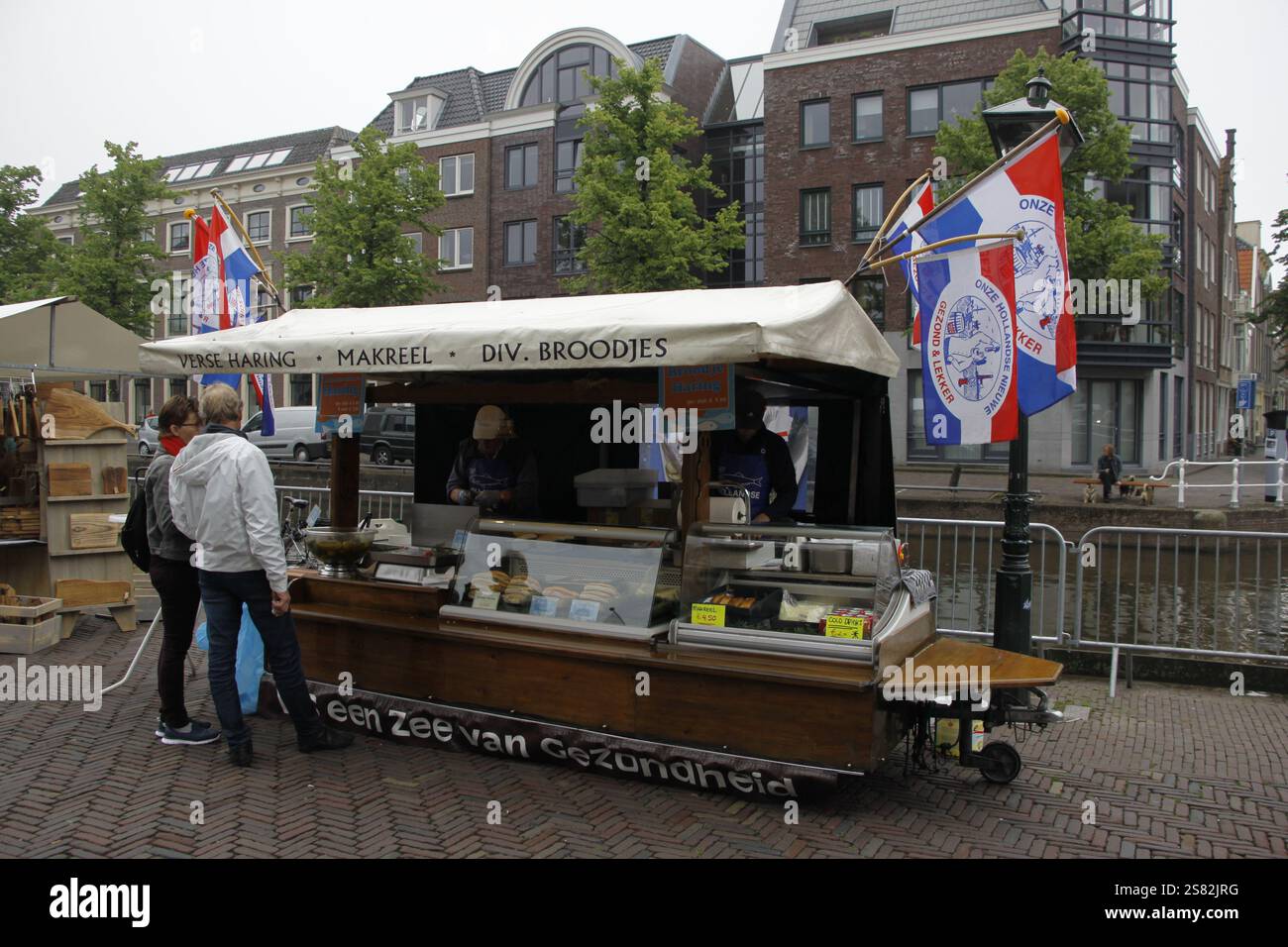 A herring cart selling the traditional maatjes haring fish, a famous ...