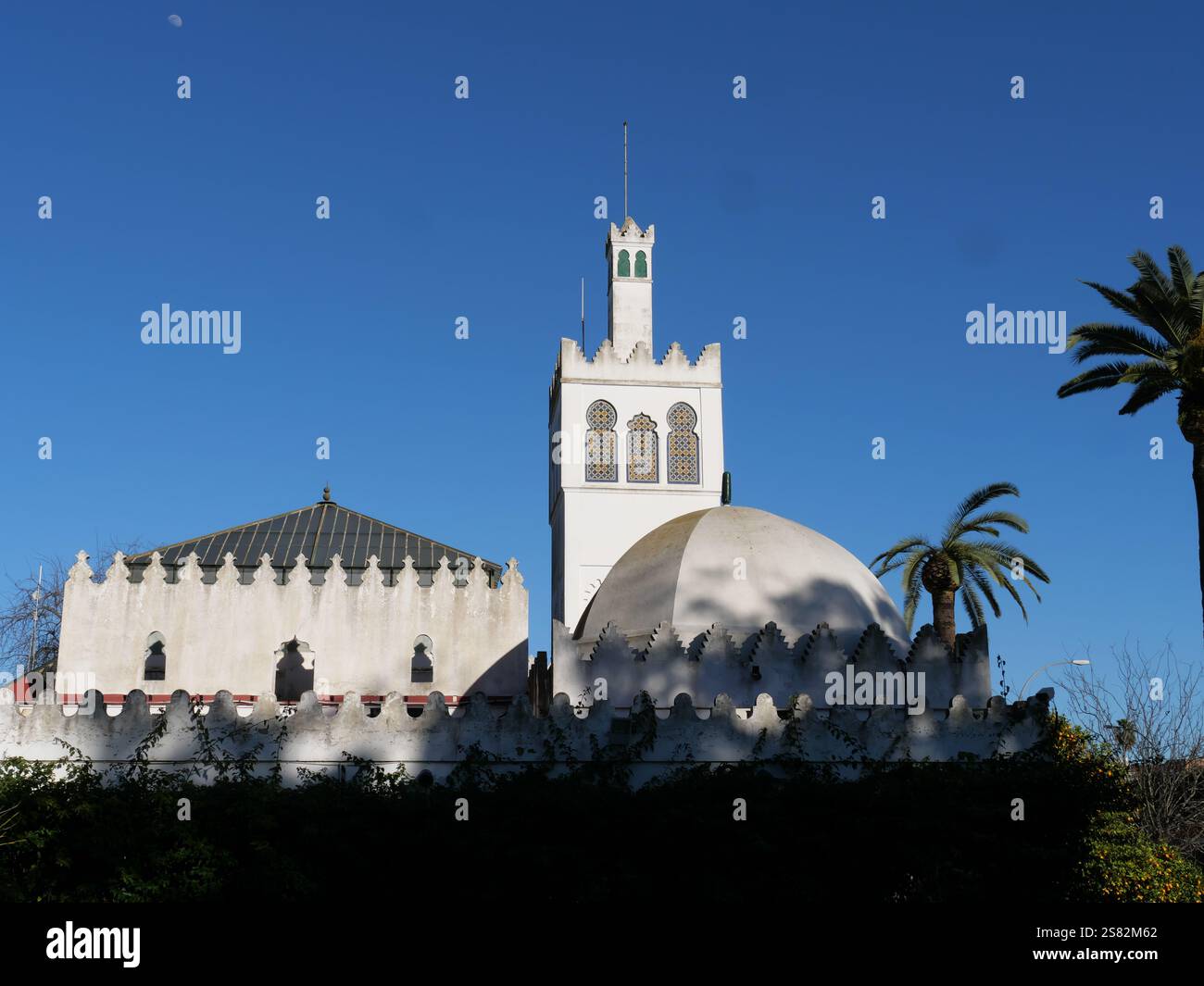 White Moorish building with tower of Sede Universitaria Olavide in ...