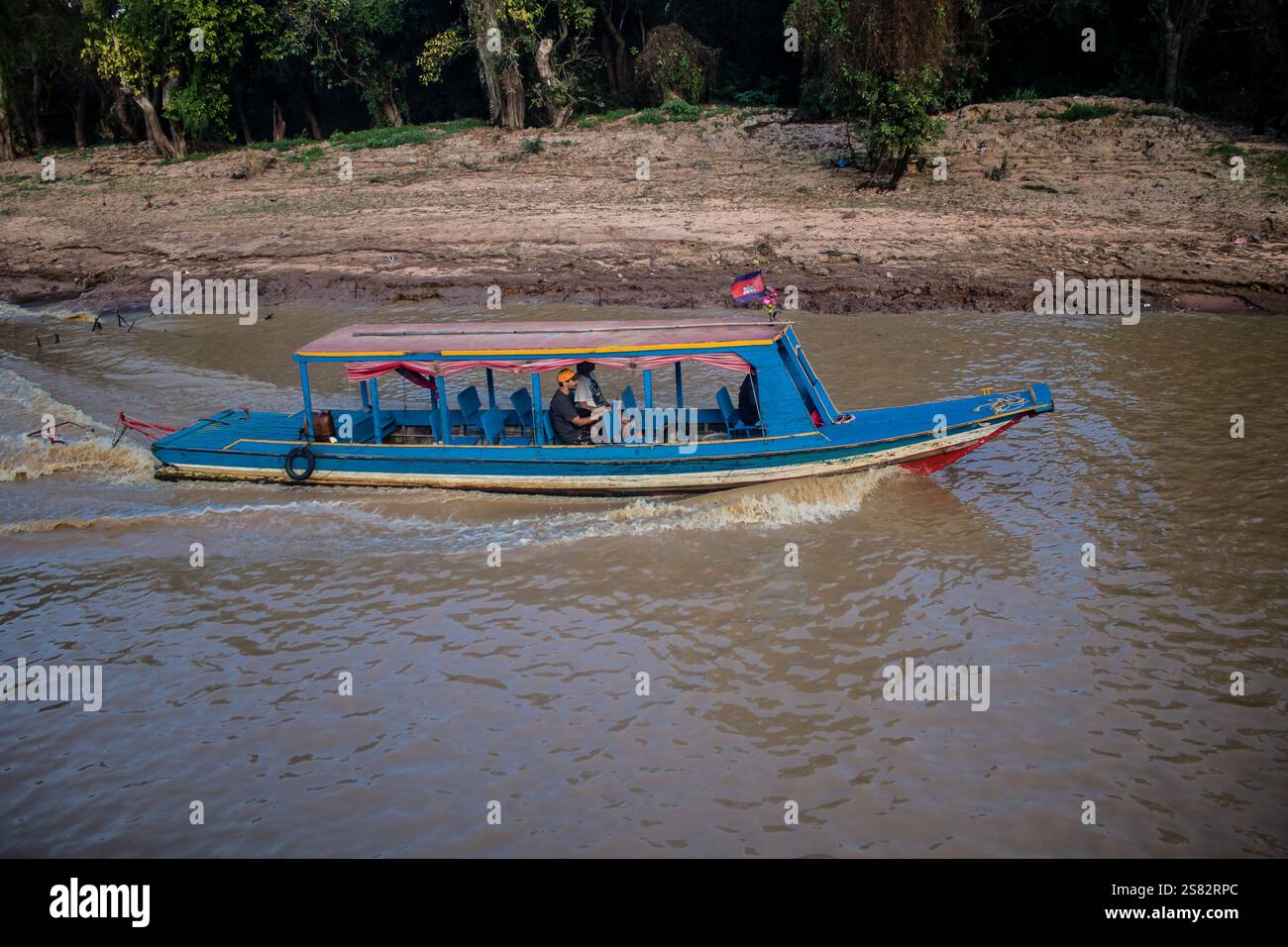 Kampong Phluk, Cambodia, January 15, 2025. Boats sail into the ...