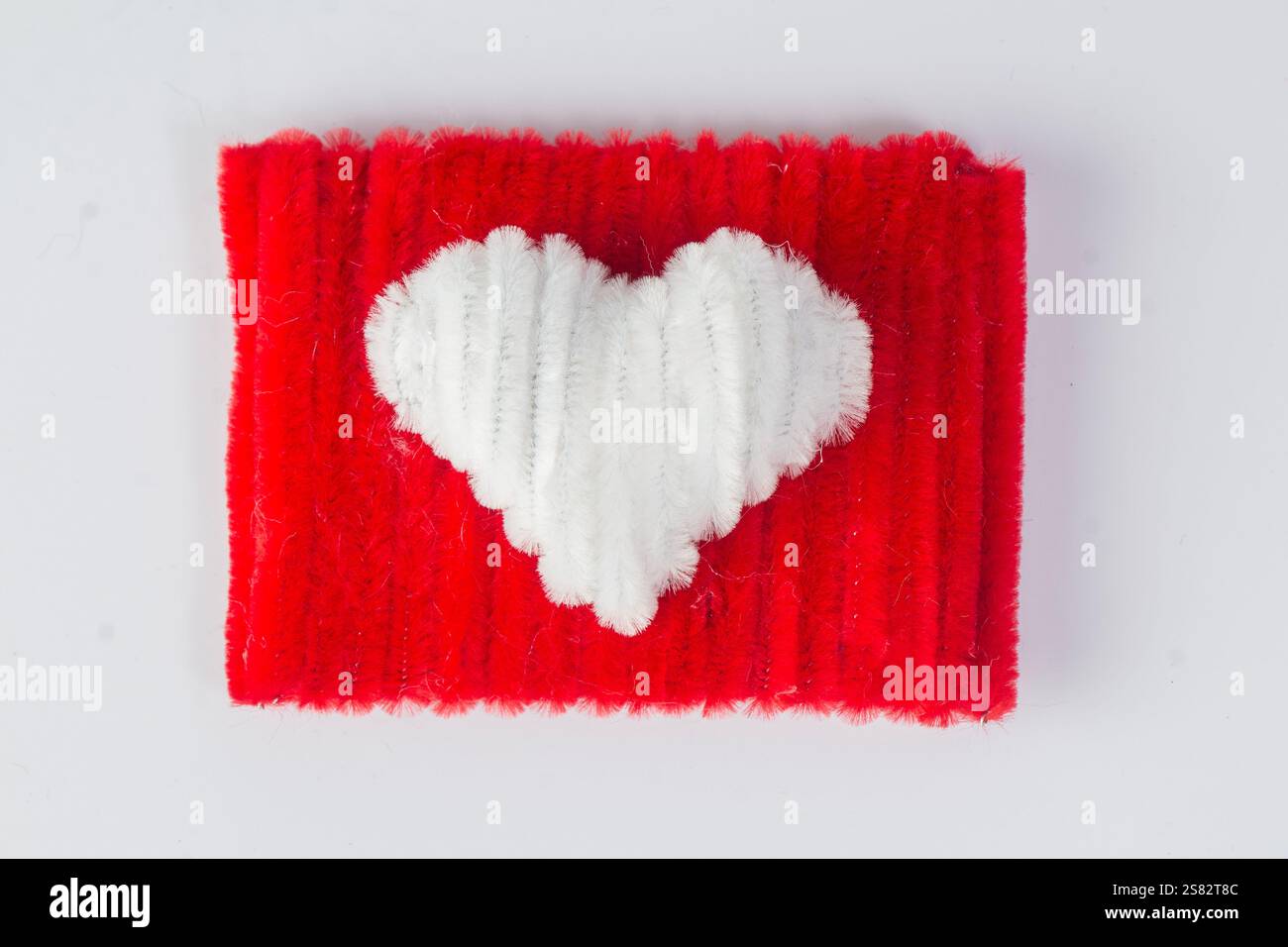 Craft pipe cleaners forming a red square in the middle forming a white ...