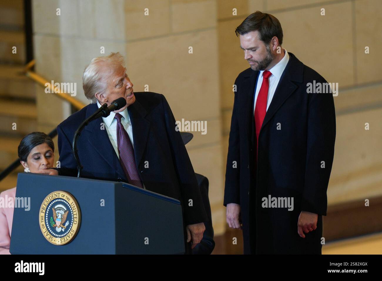 President Donald Trump speaks as Vice President JD Vance listens in ...