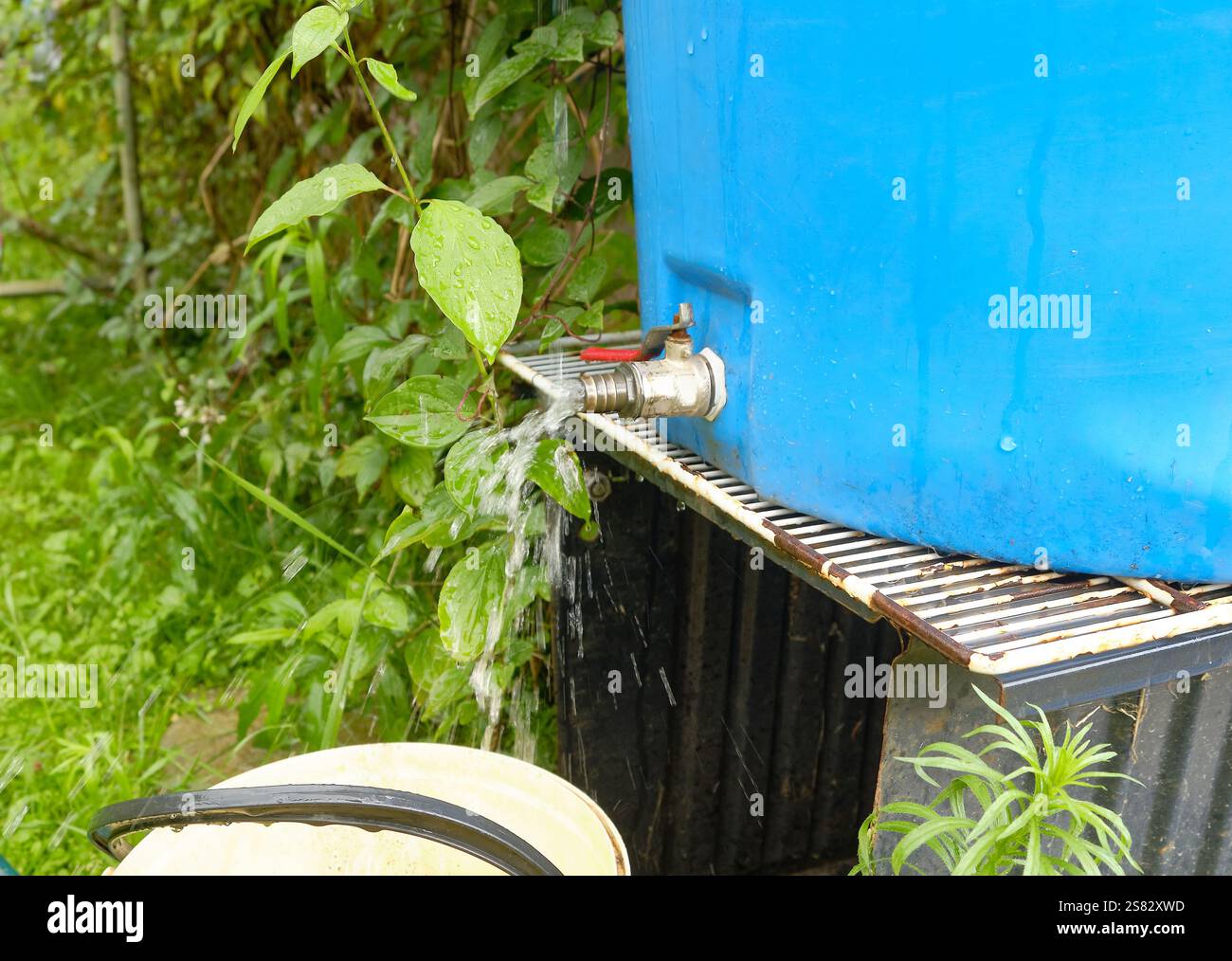 Overflow valve. water collection tank under a roof with a drain. Rain ...