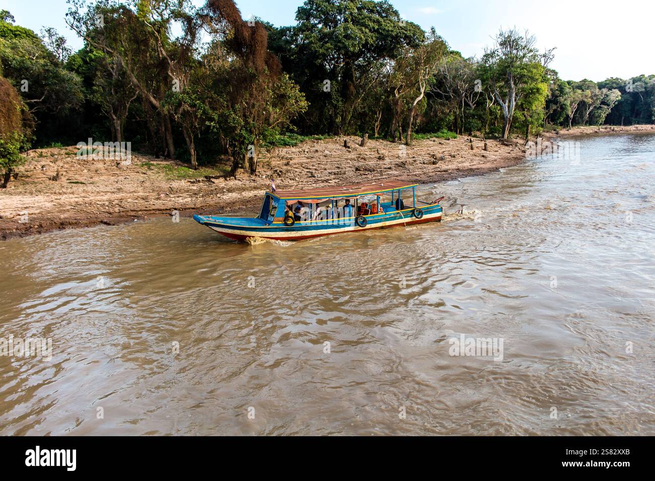 Kampong Phluk, Cambodia, January 15, 2025. Boats sail into the ...
