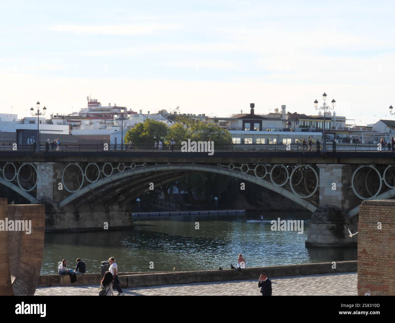 The Puente de Isabel II, a historic iron bridge, connects the center of ...