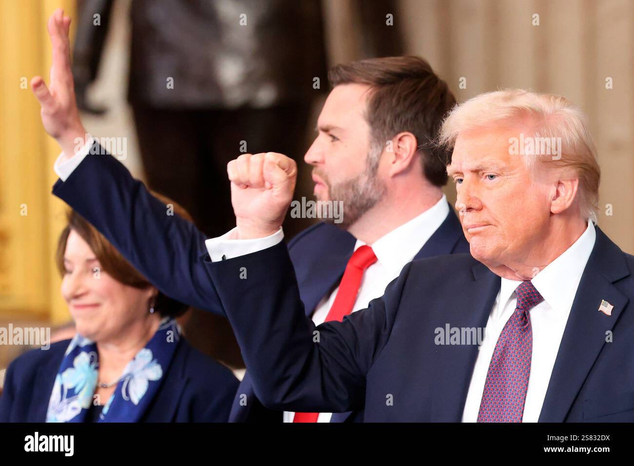 U.S. Vice President J.D. Vance and U.S. President Donald Trump gesture ...