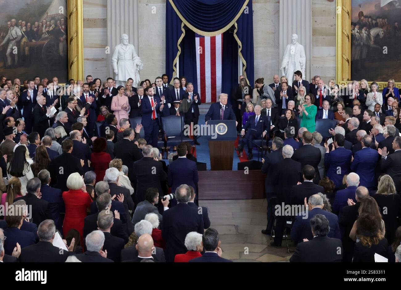 Attendees applaud U.S. President Donald Trump on the day of his ...