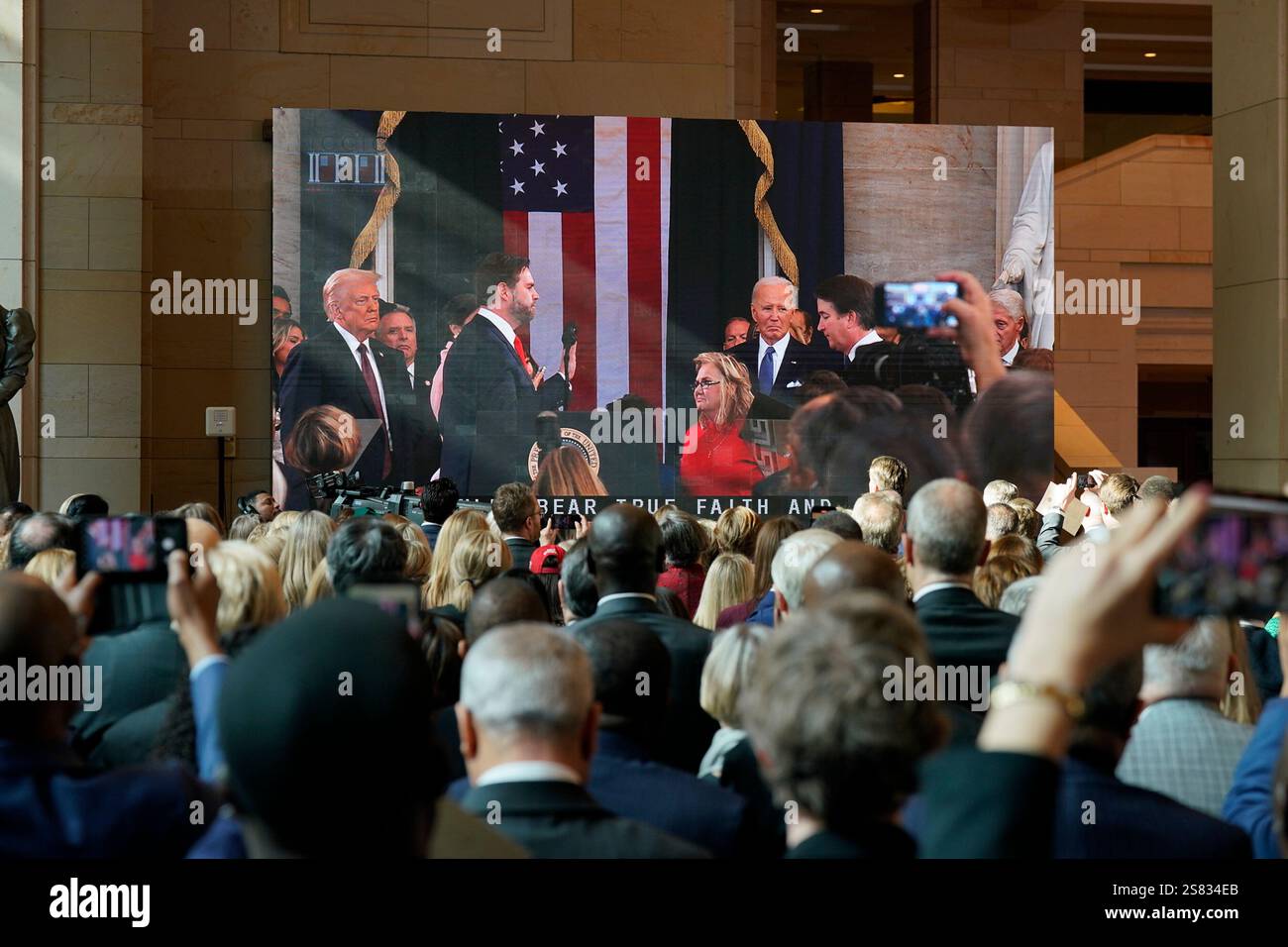 Guests and supporters are seen in an overflow room in Emancipation Hall ...