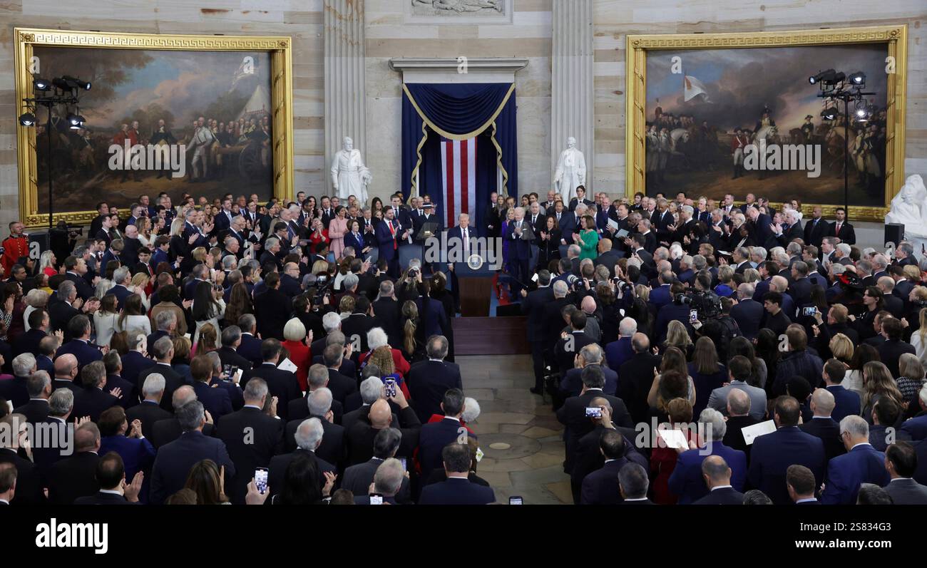 Attendees applaud U.S. President Donald Trump on the day of his ...