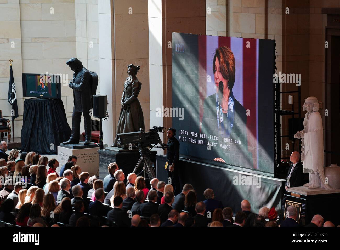 Attendees watch a livestream in Emancipation Hall showing Sen. Amy ...