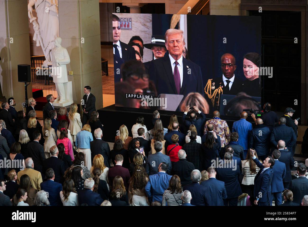 Attendees watch a livestream in Emancipation Hall showing President ...