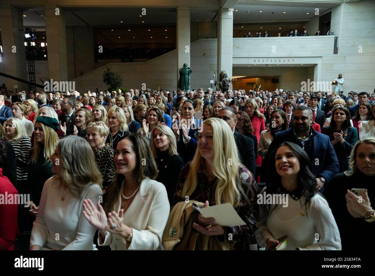 Guests and supporters are seen in an overflow room in Emancipation Hall ...