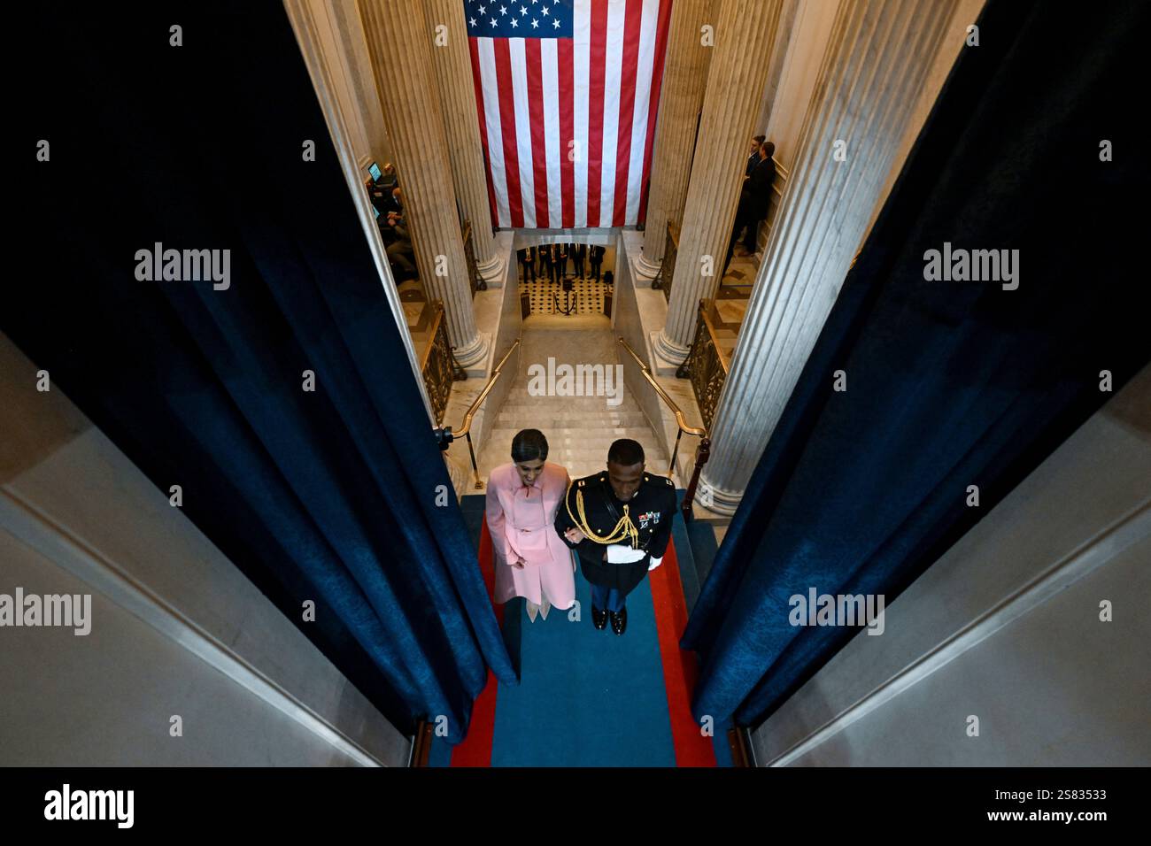 NYTINAUG25 -- Usha Vance entering the stage as the inauguration of ...