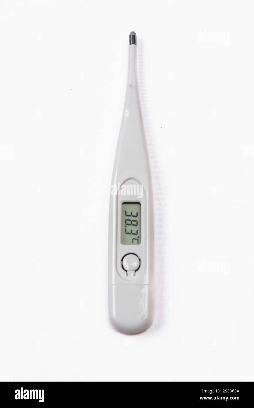 Digital thermometer displaying 38.3 C on LCD screen Stock Photo - Alamy