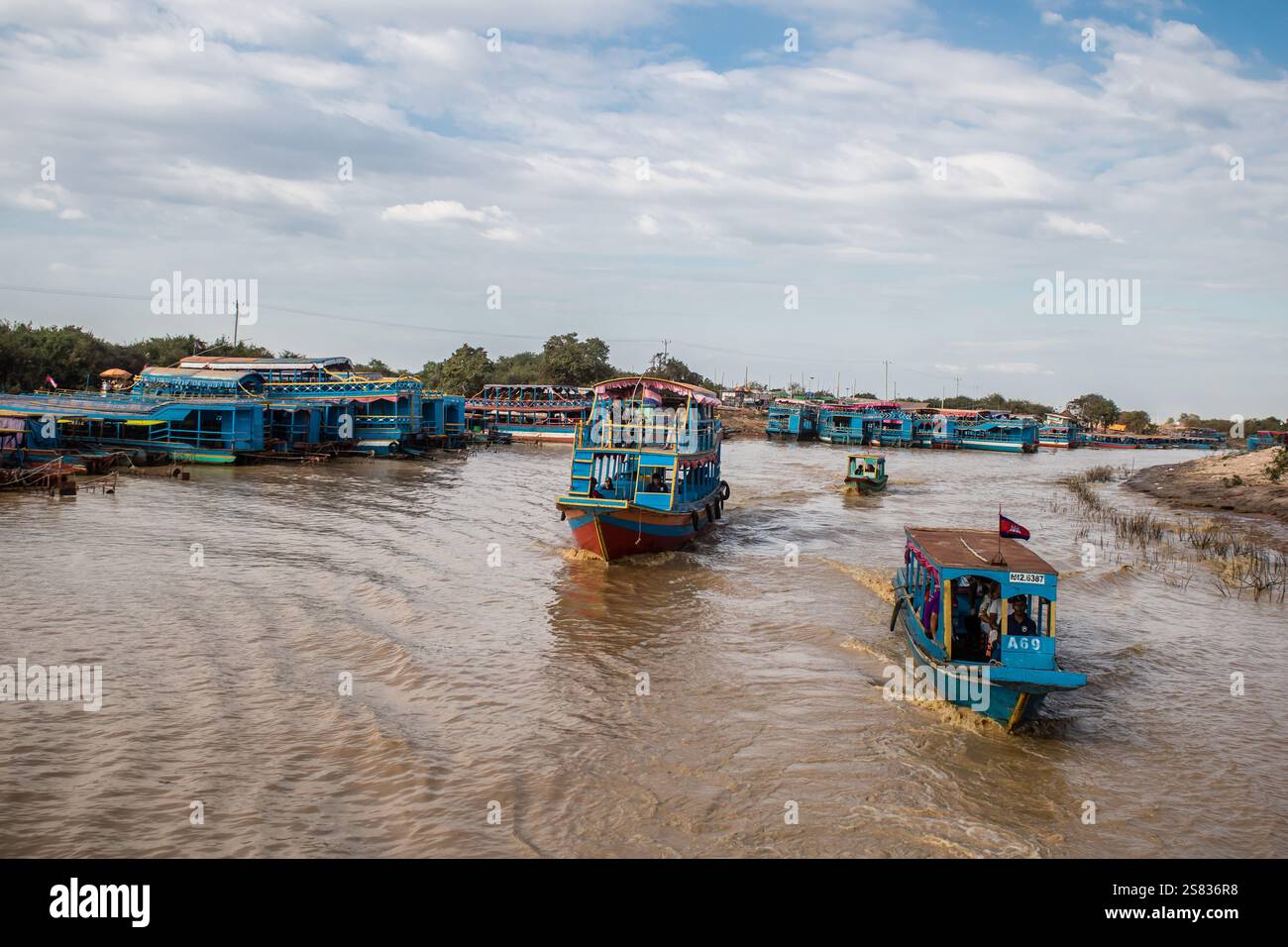 Kampong Phluk, Cambodia, January 15, 2025. Boats sail into the ...