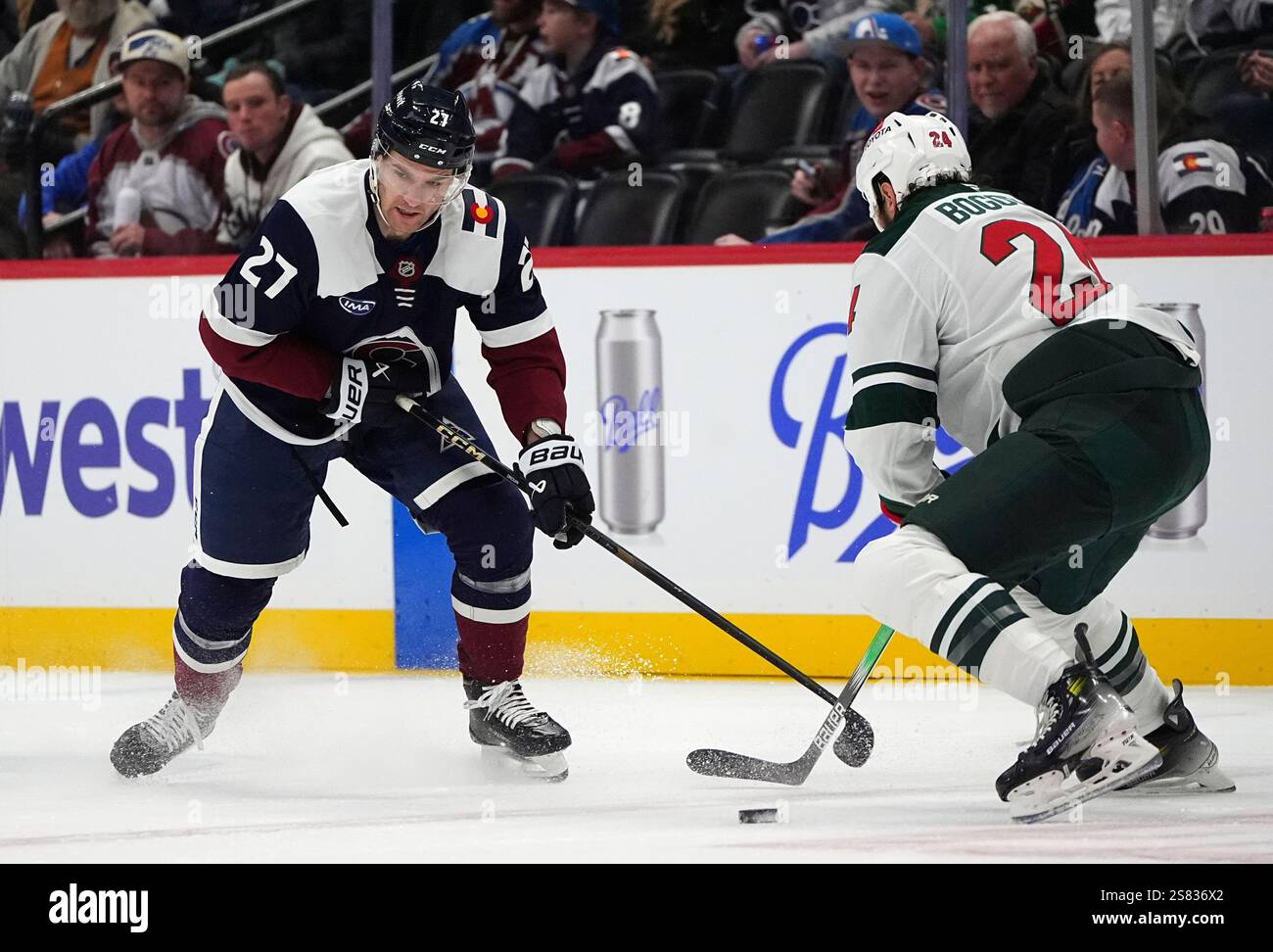 Colorado Avalanche left wing Jonathan Drouin, left, fights for control ...