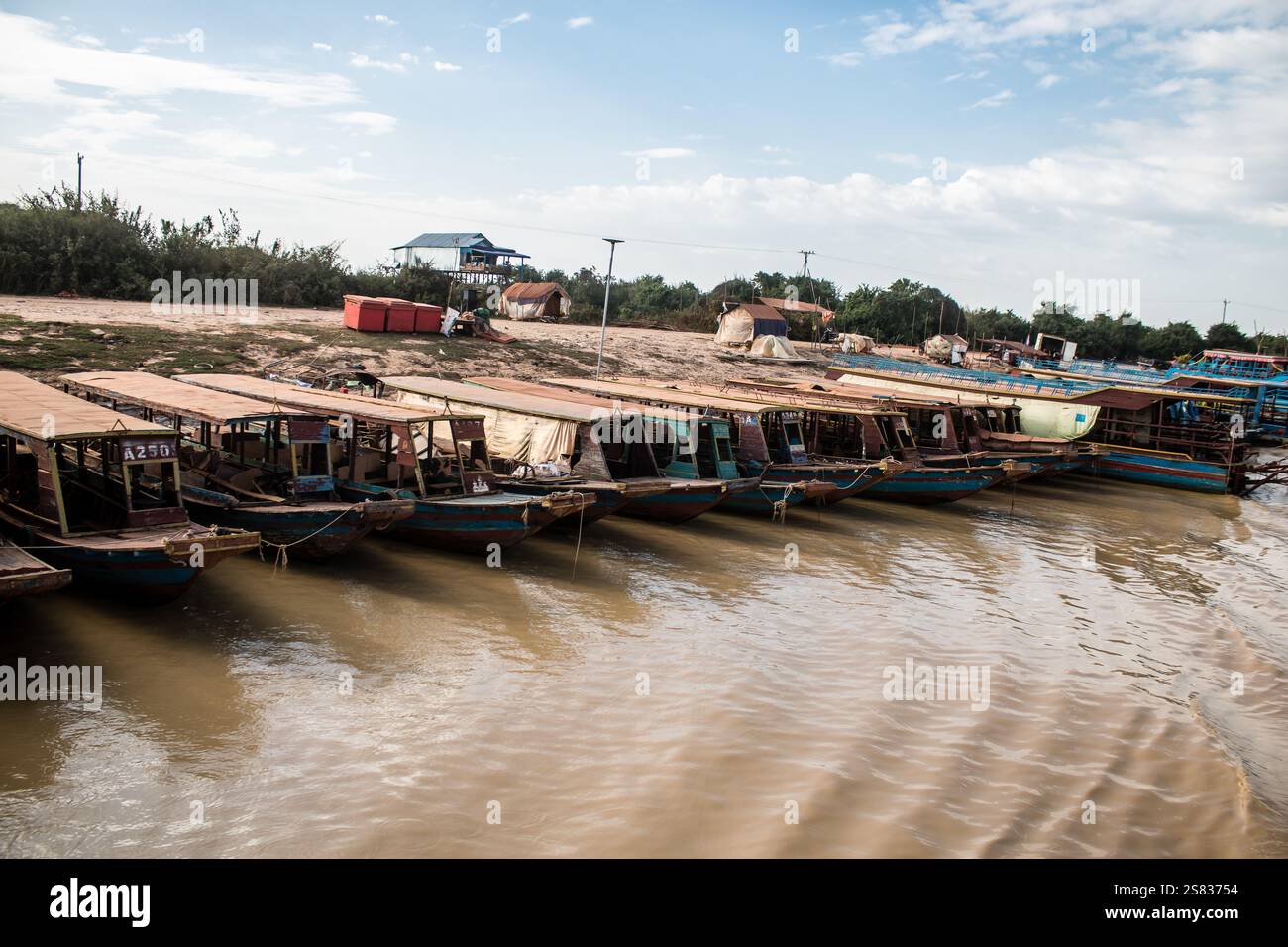 Kampong Phluk, Cambodia, January 15, 2025. Boats sail into the ...