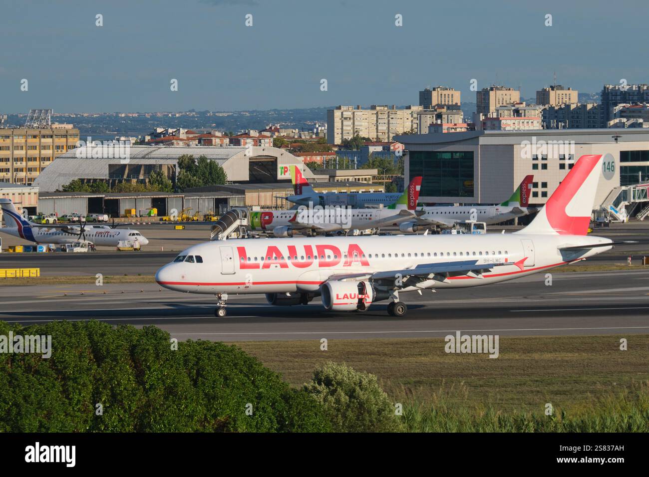 Lauda Europe Airbus A320-214 passenger plane taxi on runway in Humberto ...