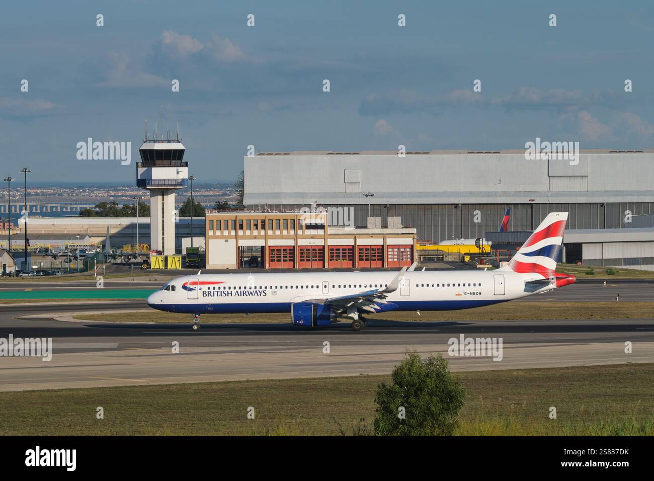 British Airways Airbus A321-251NX passenger plane taxi on runway in Humberto Delgado Airport in ...