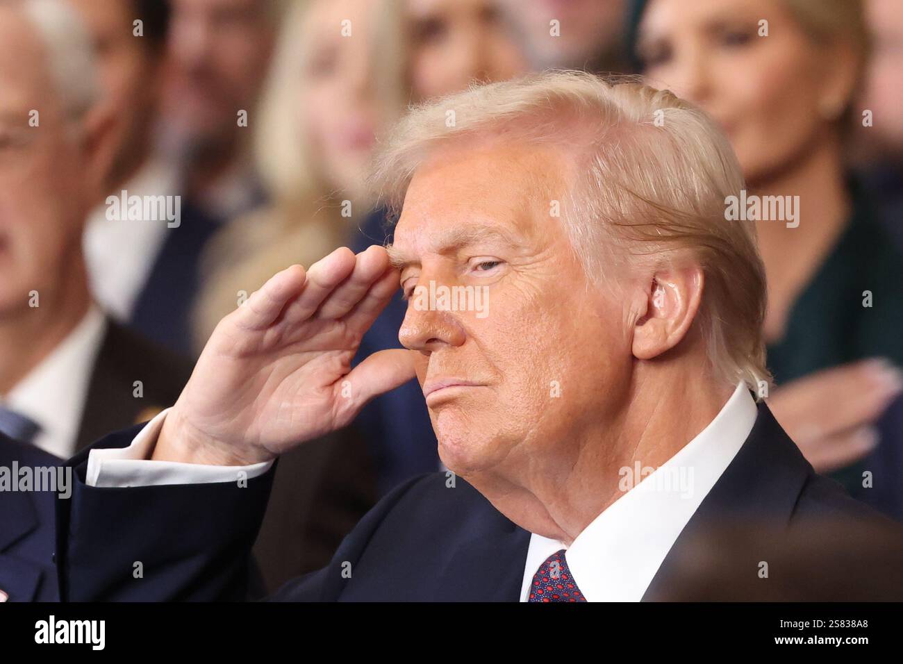 U.S. President Donald Trump salutes during the singing of the Star ...