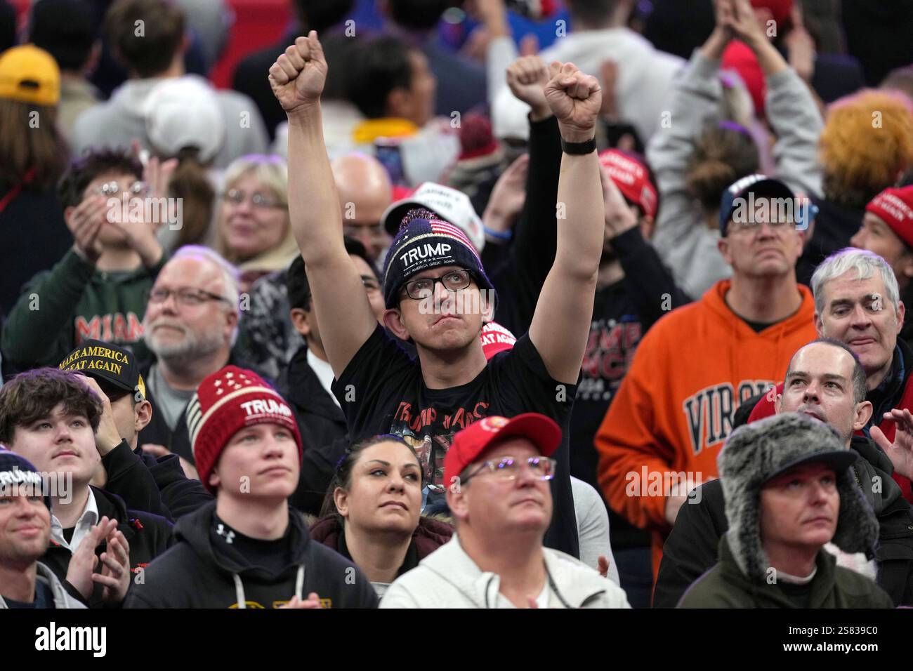 Attendees cheer at an indoor Presidential Inauguration parade event in ...