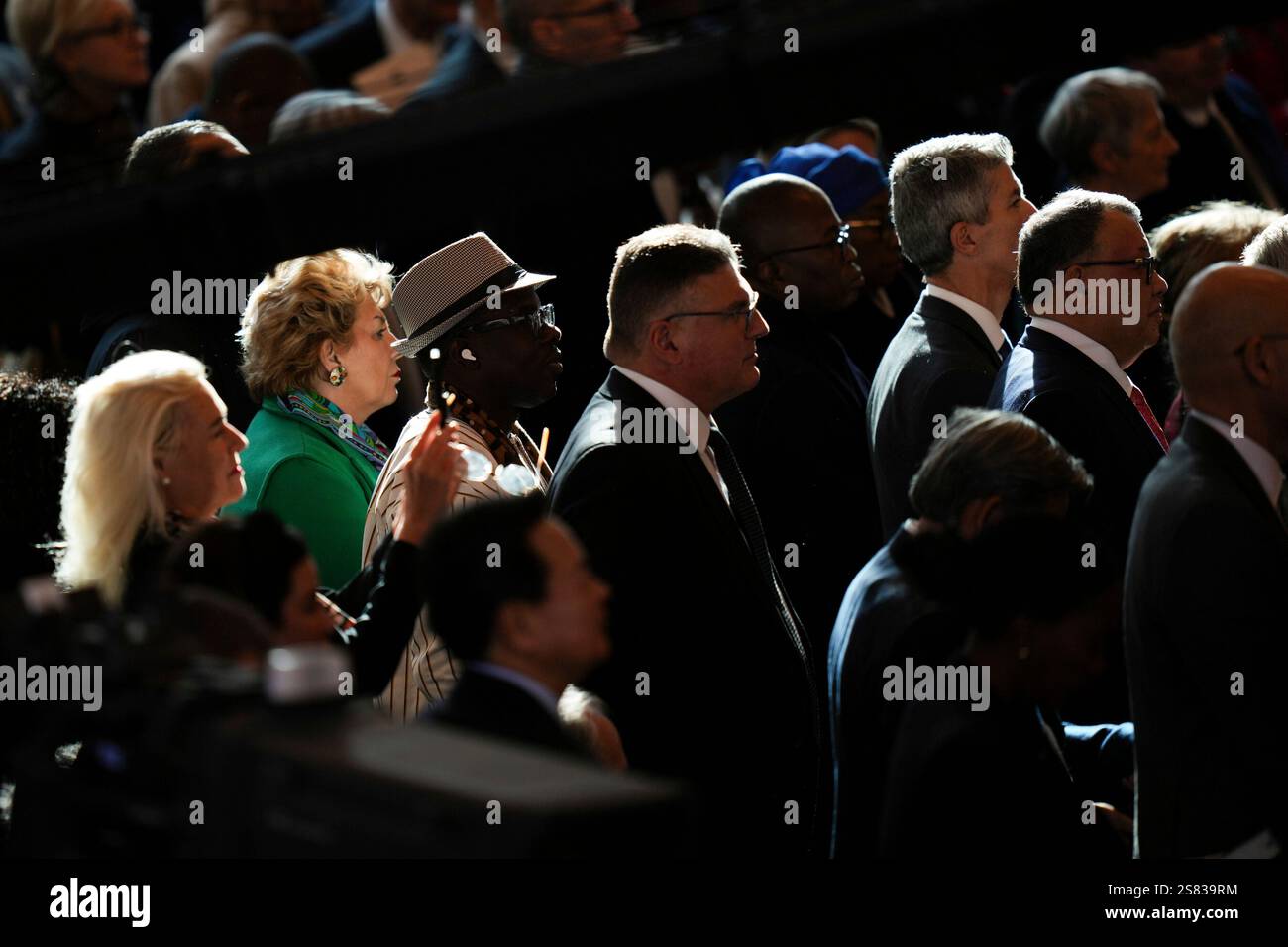 Attendees listen as President Donald Trump delivers remarks in ...