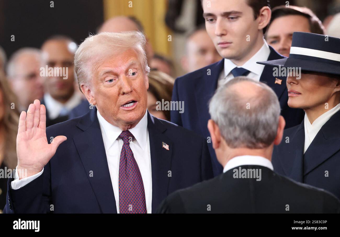U.S. President Donald Trump takes oath as Barron Trump and Melania ...