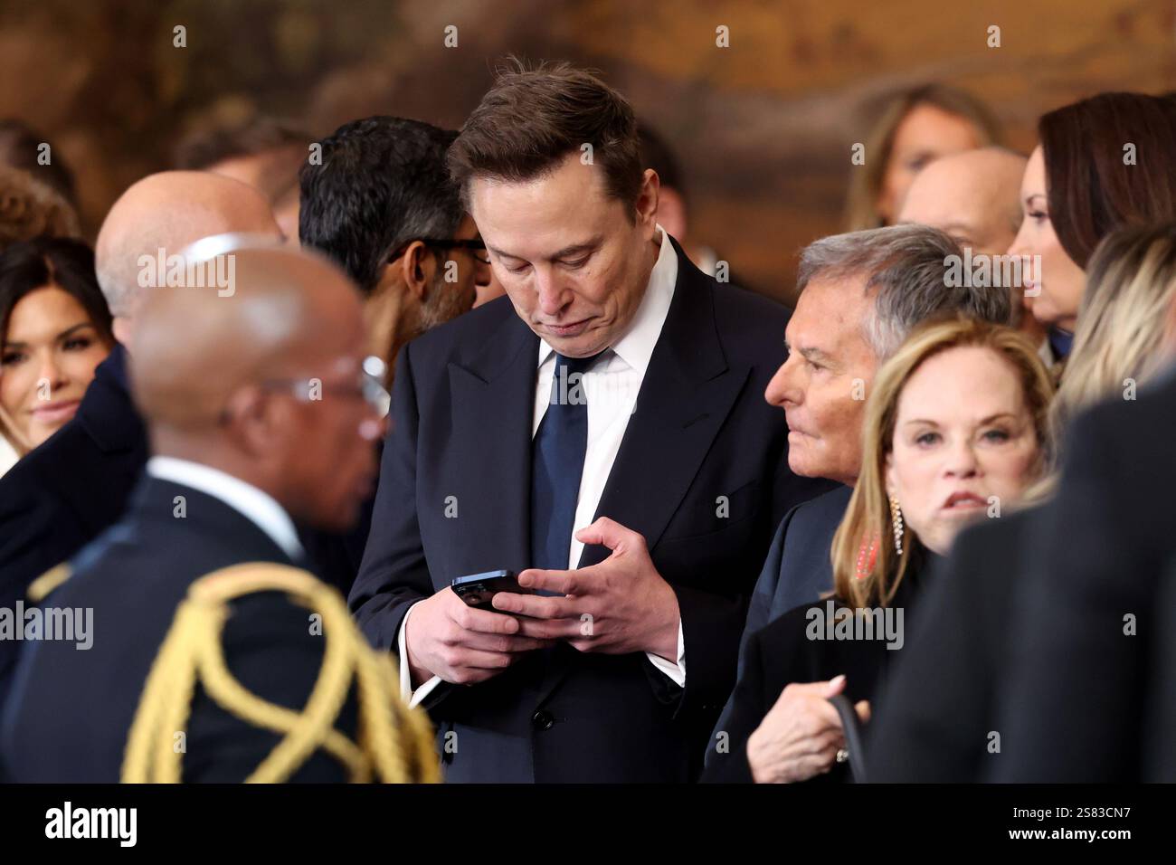 Washington, United States. 20th Jan, 2025. Elon Musk holds his phone on ...