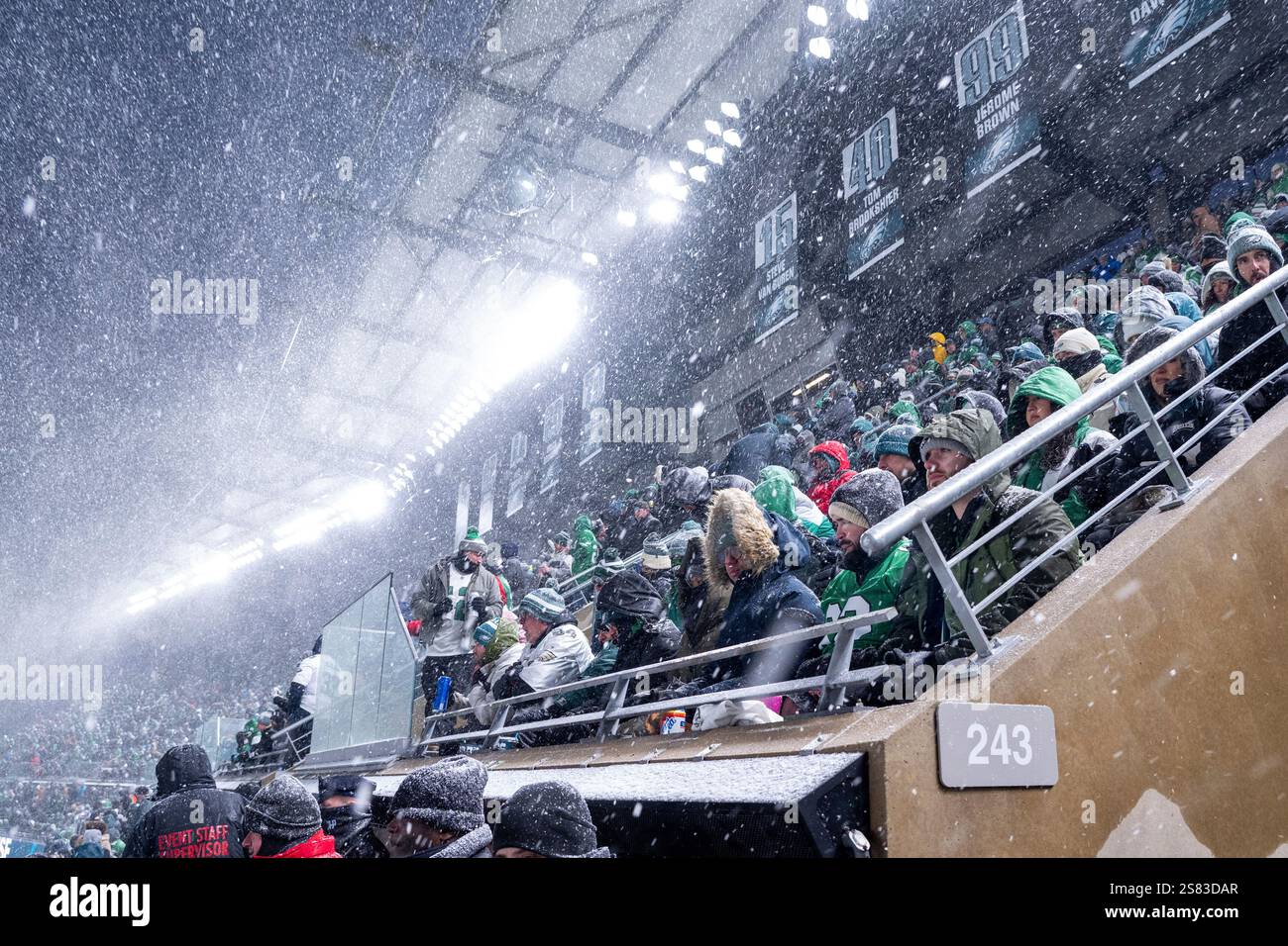 Philadelphia Eagles fans cheering their team on in the snow during the ...