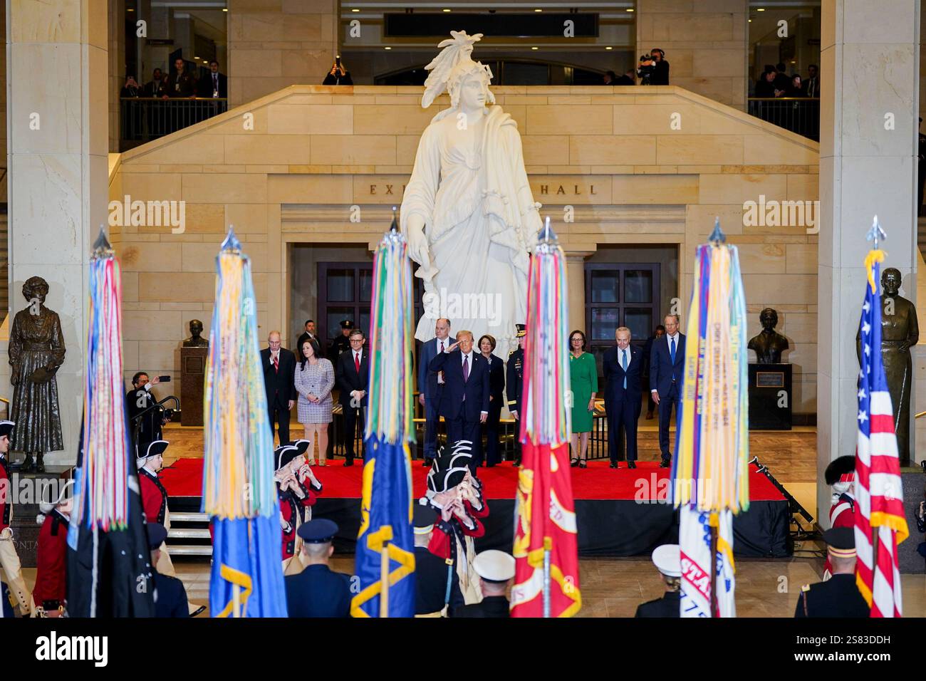 President Donald Trump salutes while on stage in Emancipation Hall at ...