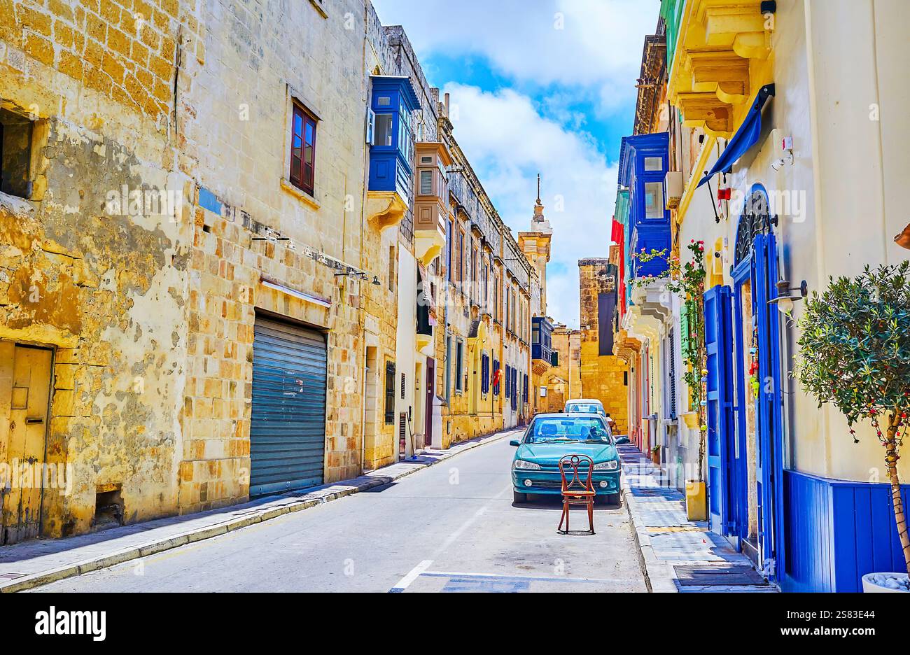 The line of scenic historic residential houses with wooden Maltese ...