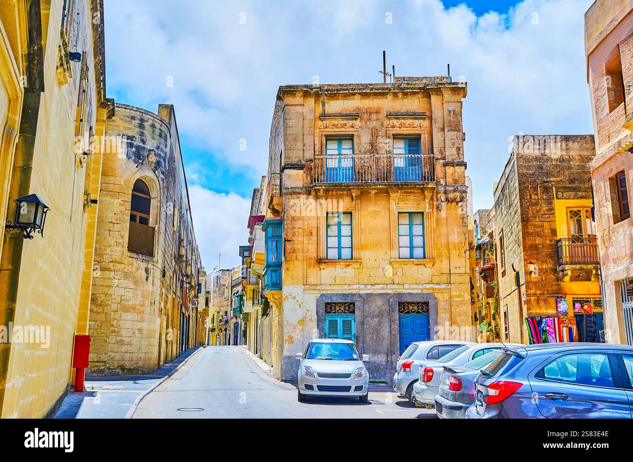 Architectural ensemble of St Paul street with old stone edifices, tiny shops and cafes, Rabat ...
