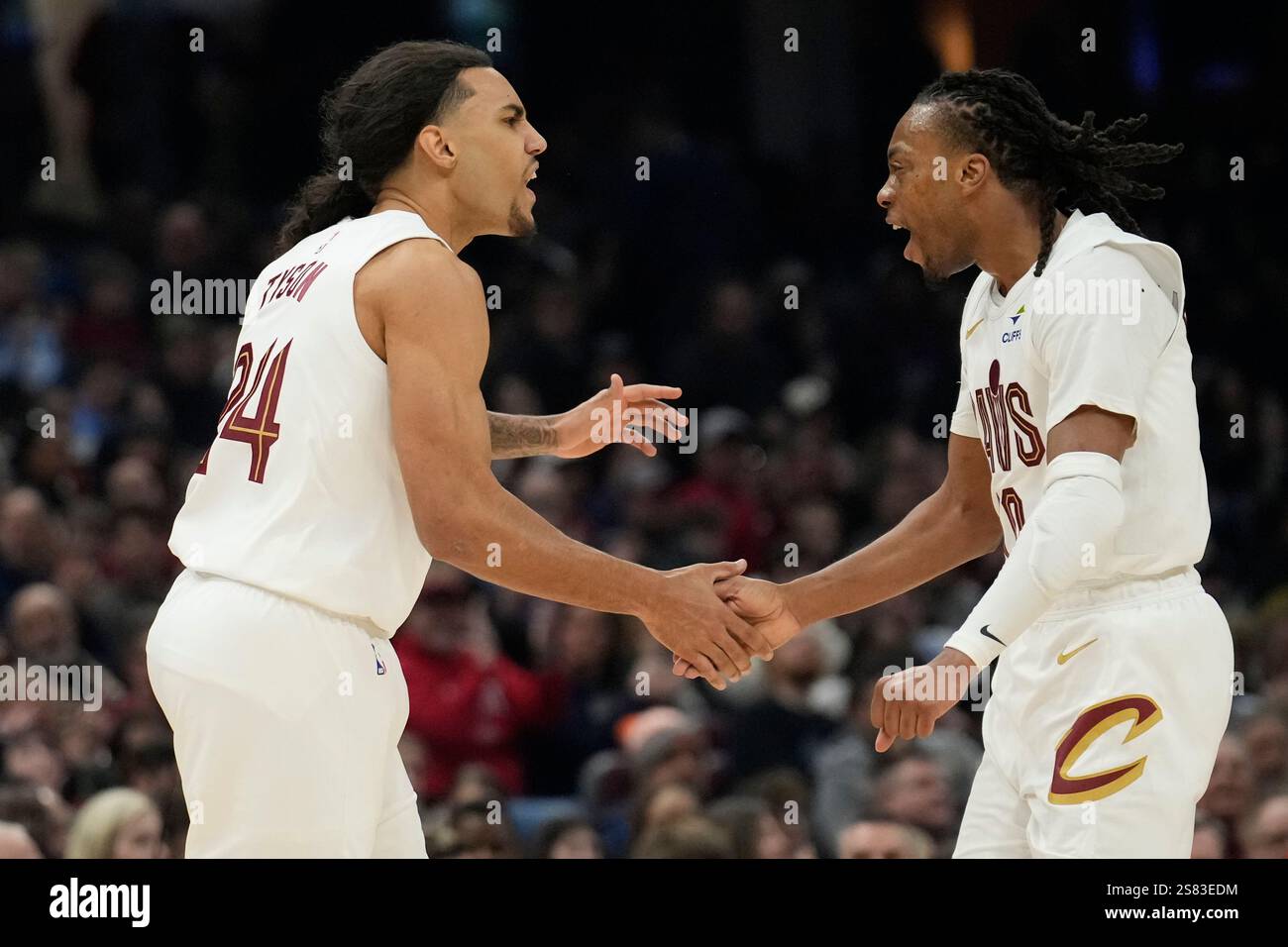 Cleveland Cavaliers forward Jaylon Tyson, left, celebrates with ...