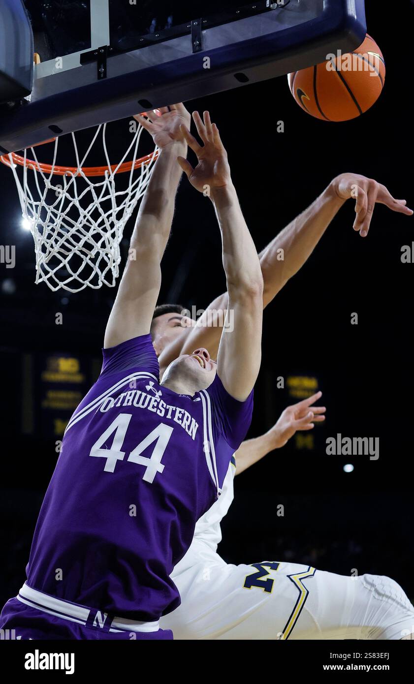 Northwestern guard Angelo Ciaravino (44) has his shot blocked by ...