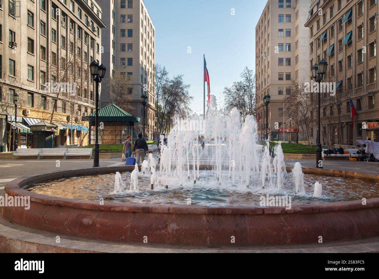 A Fountain and the elegant buildings at Paseo Bulnes, downtown Santiago ...