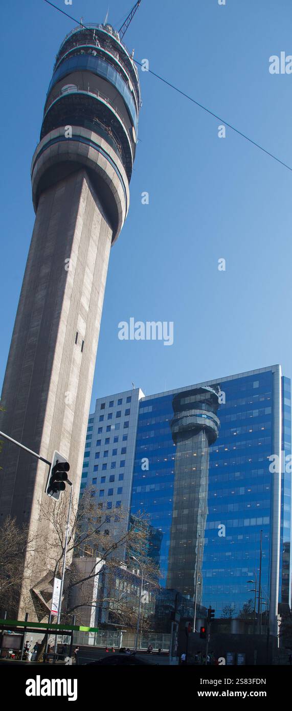 The ENTEL Communications tower reflected on a modern glass windows ...