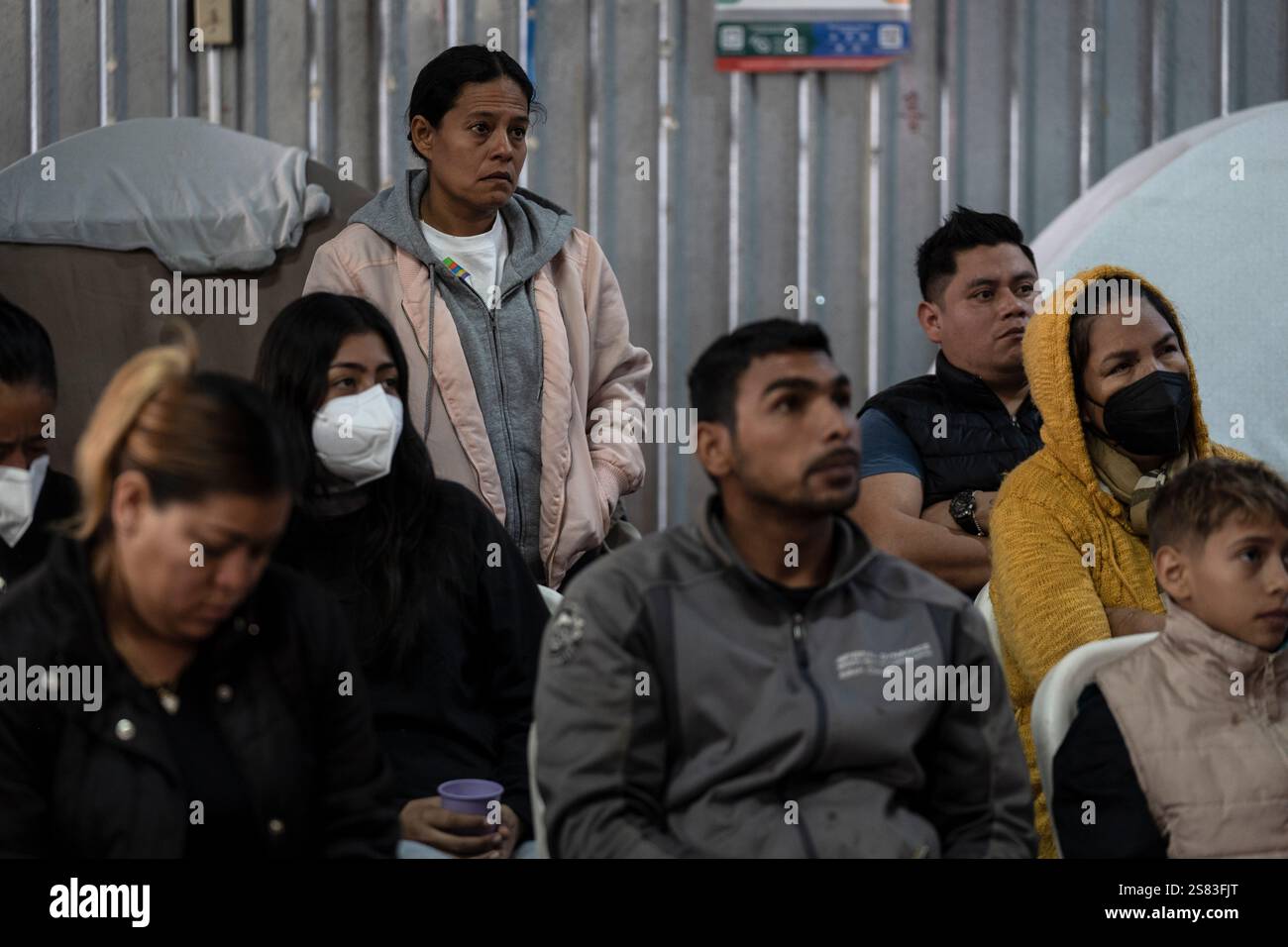 Tijuana, Mexico. 20th Jan, 2025. Latin American migrants watch the ...