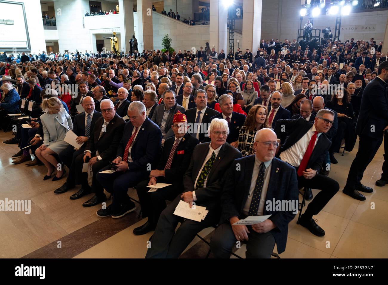 Guests and supporters are seen in an overflow room in Emancipation Hall ...